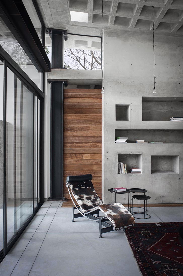 Secluded intimate spaces merged socially in Odd house design of Quito ...